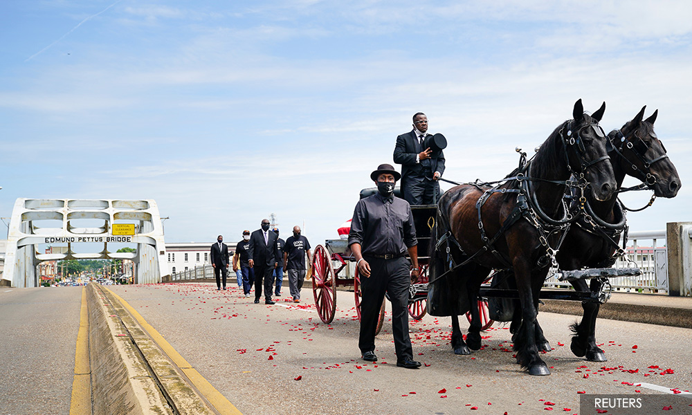 Body of civil rights icon John Lewis crosses Alabama bridge for final time