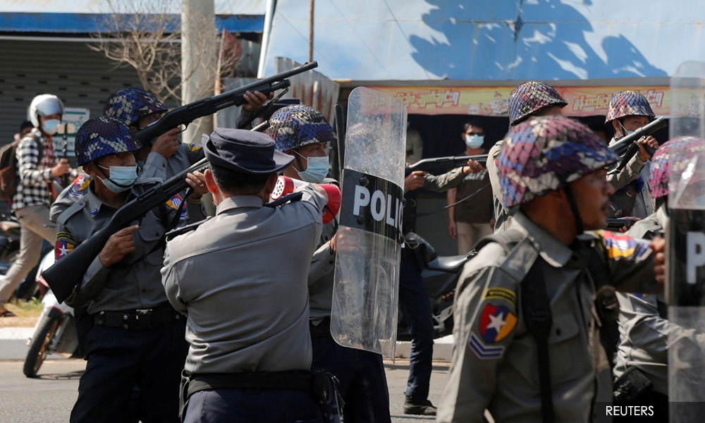 Myanmar army tightens laws on overnight guests as police hunt protesters