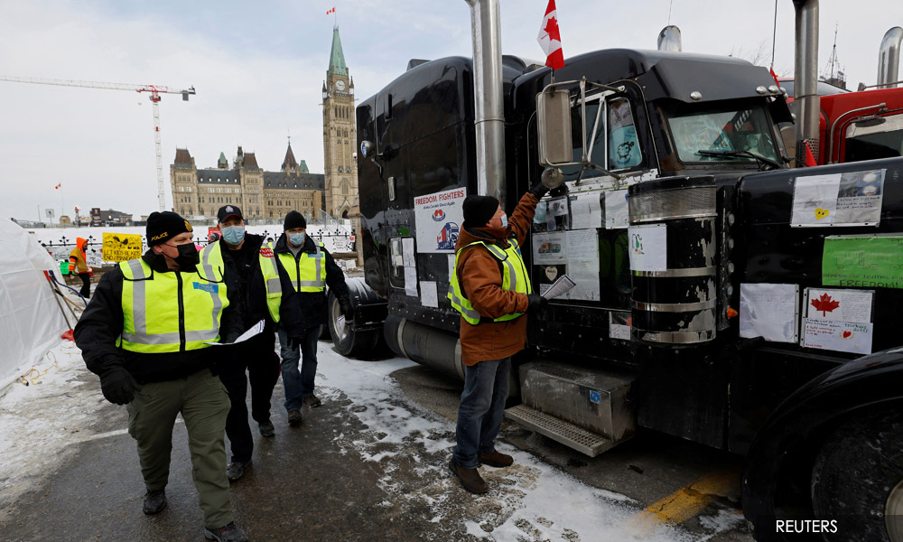 Canada police threaten protesters with arrest; govt links blockade to ...
