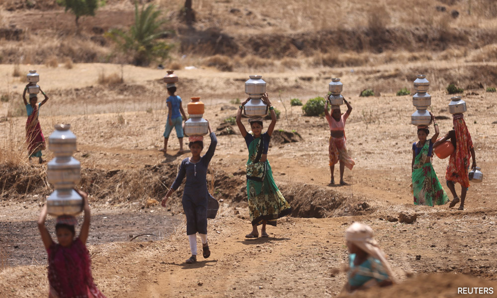 Women, children trek miles in summer heat to get water near India's Mumbai